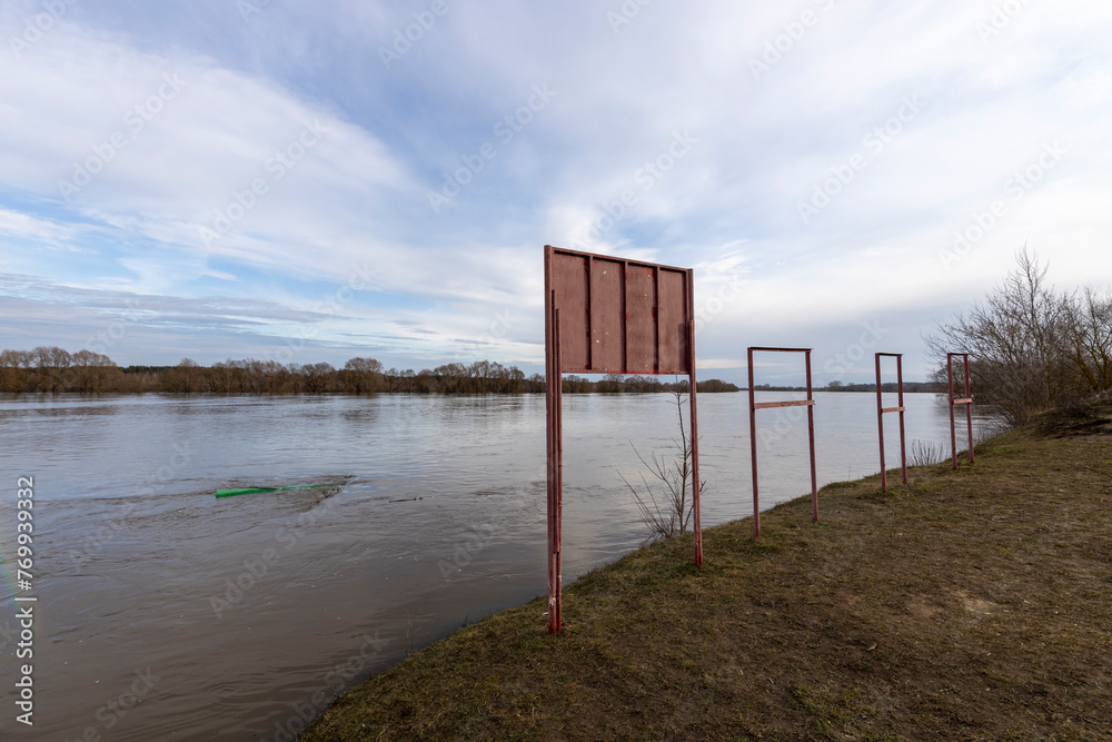 early spring flood, high water in the countryside, river overflowing ...