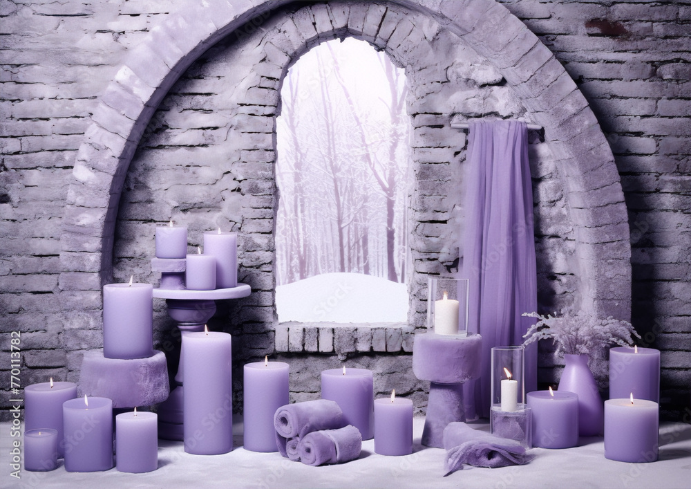 Still life of purple candles and winter landscape in arch with stone ...