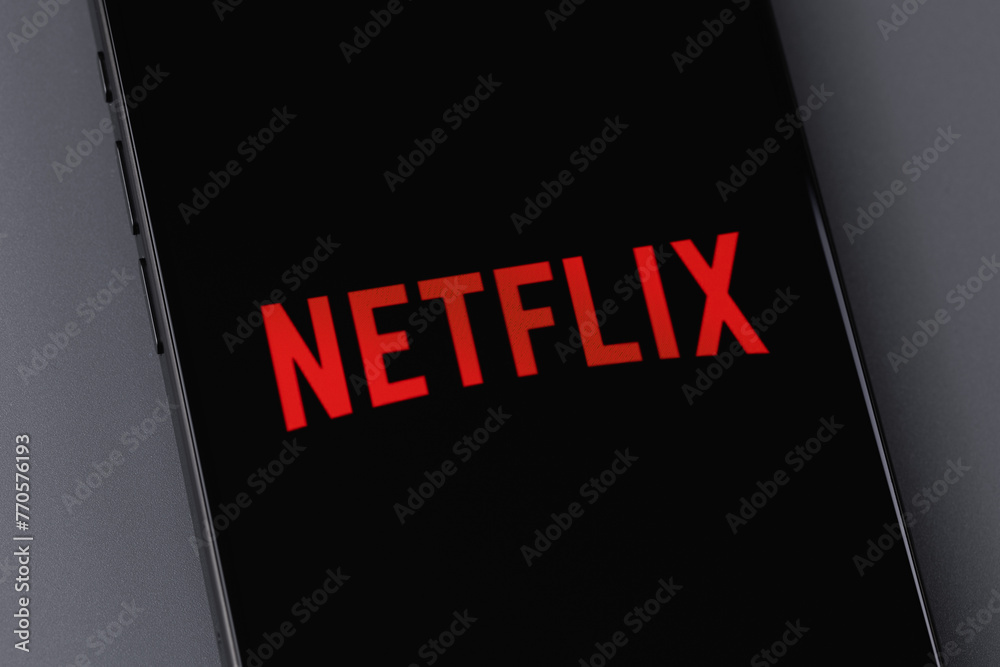 Netflix logo mobile app on a screen smartphone iPhone closeup. Netflix ...