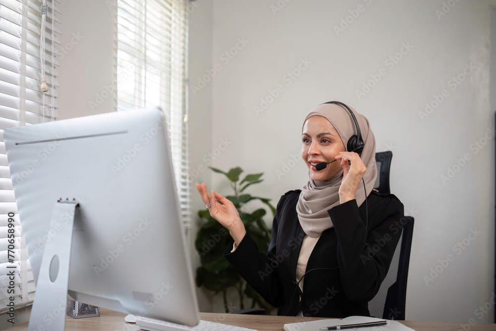 Young muslim women wearing hijab telemarketing or call center agent ...