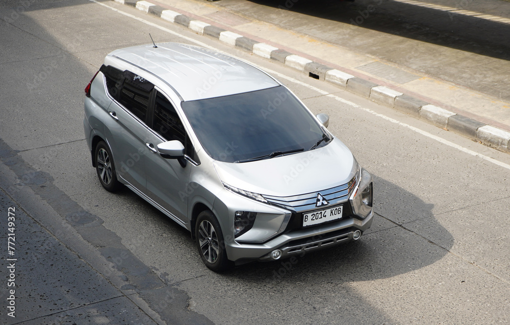 silver SUV Mitsubishi Xpander, drive at commercial area Gunung sahari ...