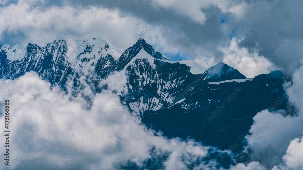 Beautiful scenery of Meili snow Mountain with clouds in Deqen County ...
