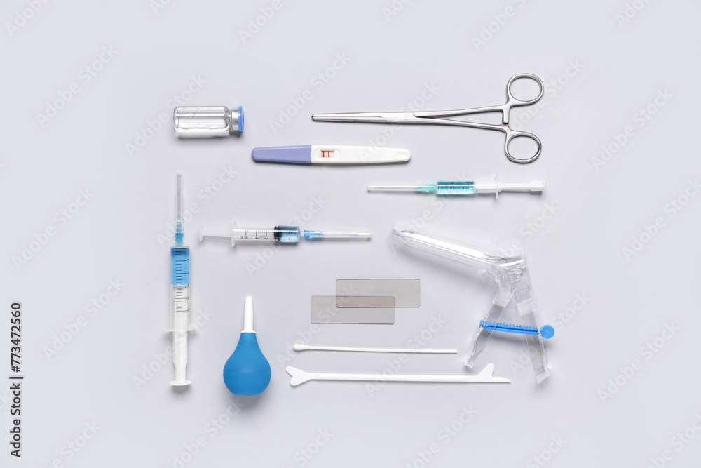 Gynecological speculum with pap smear test tools, syringes and ampule ...