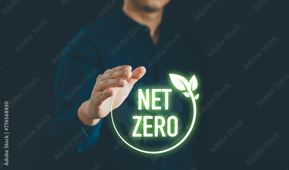 Businessman holding net zero icon with globe outline background for Net ...