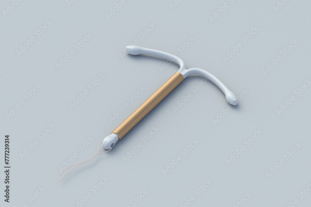 Birth control device on gray background. T-shape female contraceptive ...