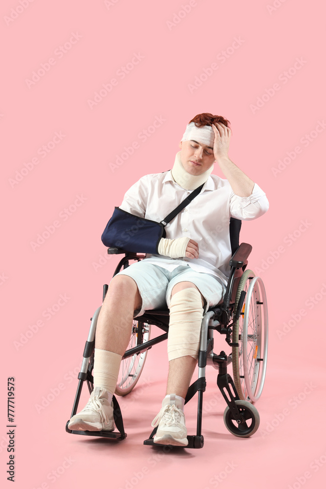 Injured young man after accident in wheelchair on pink background Stock ...