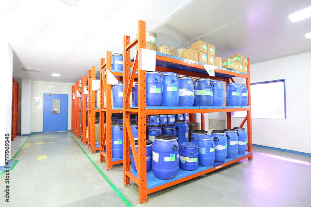 full warehouse filled with pharma blue container rack for storage and ...