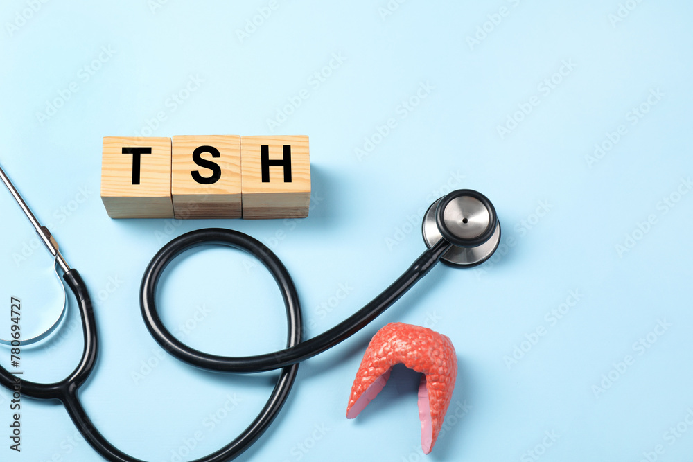 Endocrinology. Stethoscope, wooden cubes with thyroid hormones and ...
