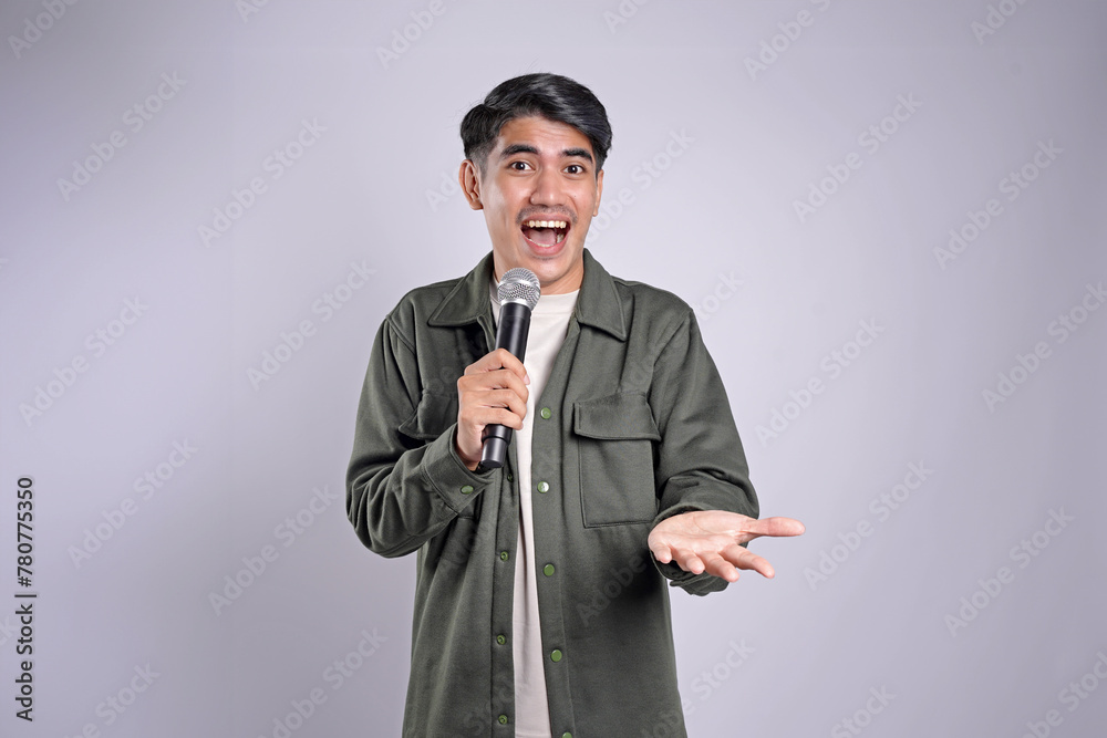 Stylist asian men singing songs with microphone, holding mic and ...