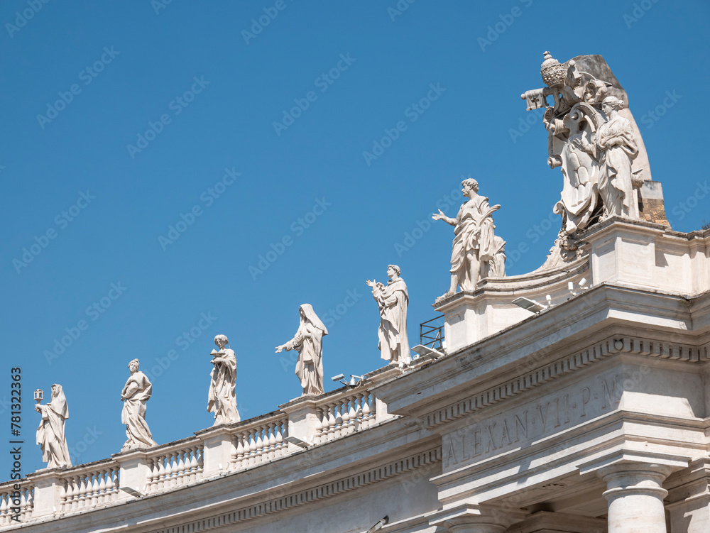 Statues of saints and apostles on colonnade of St. Peter's basilica ...