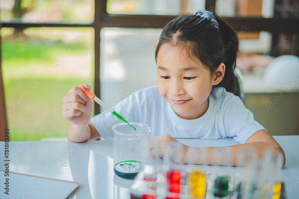 little scientist looking through a microscope and test tubes filled ...