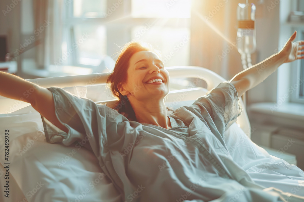 Caucasian cheerful woman patient with arms outstretched on hospital bed ...