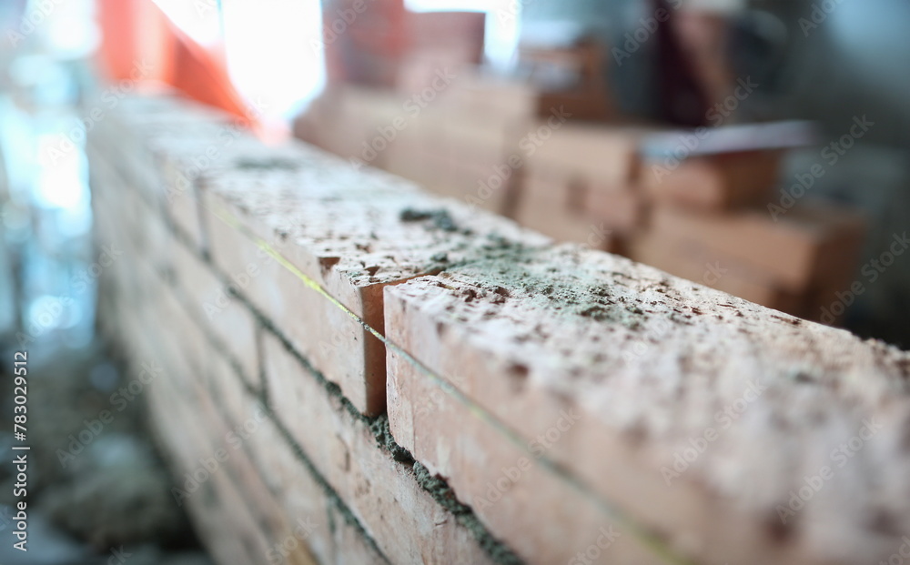 Focus on brickwork laid in big room with great ability and skill. Great ...