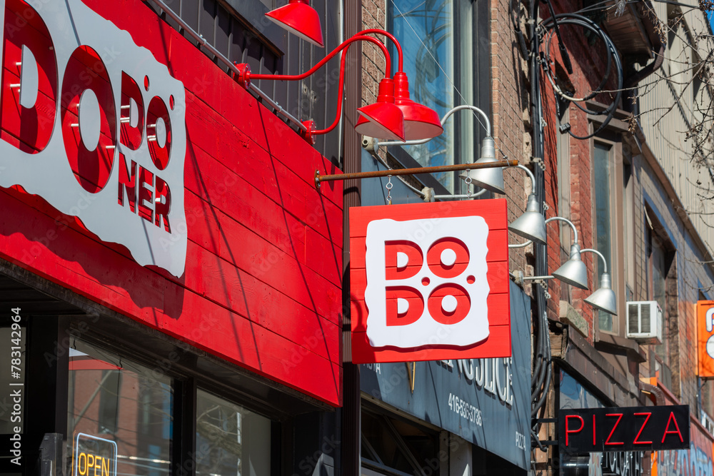 exterior buildings and sign of DoDoner, a doner kebah restaurant ...