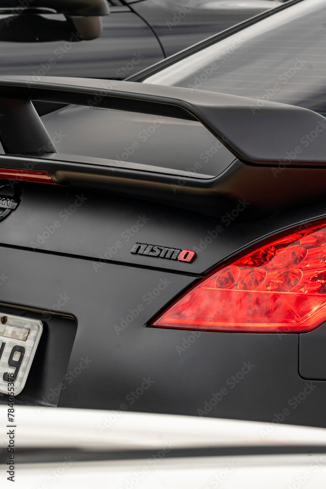 Nissan 370z Nismo matte black, rear end badge and tail light focused ...