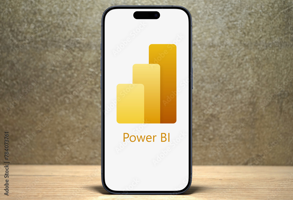 Microsoft Power Bi logo is displayed on a modern smartphone standing on ...