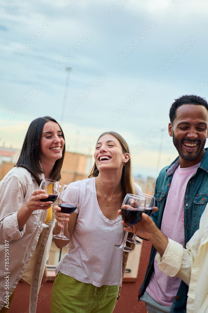 Vertical. Cheerful group multiracial young friends laughing holding ...