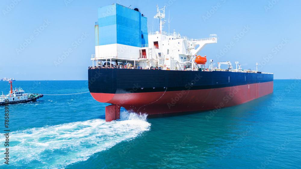 Propeller of large ship spinning power working and water splash ...
