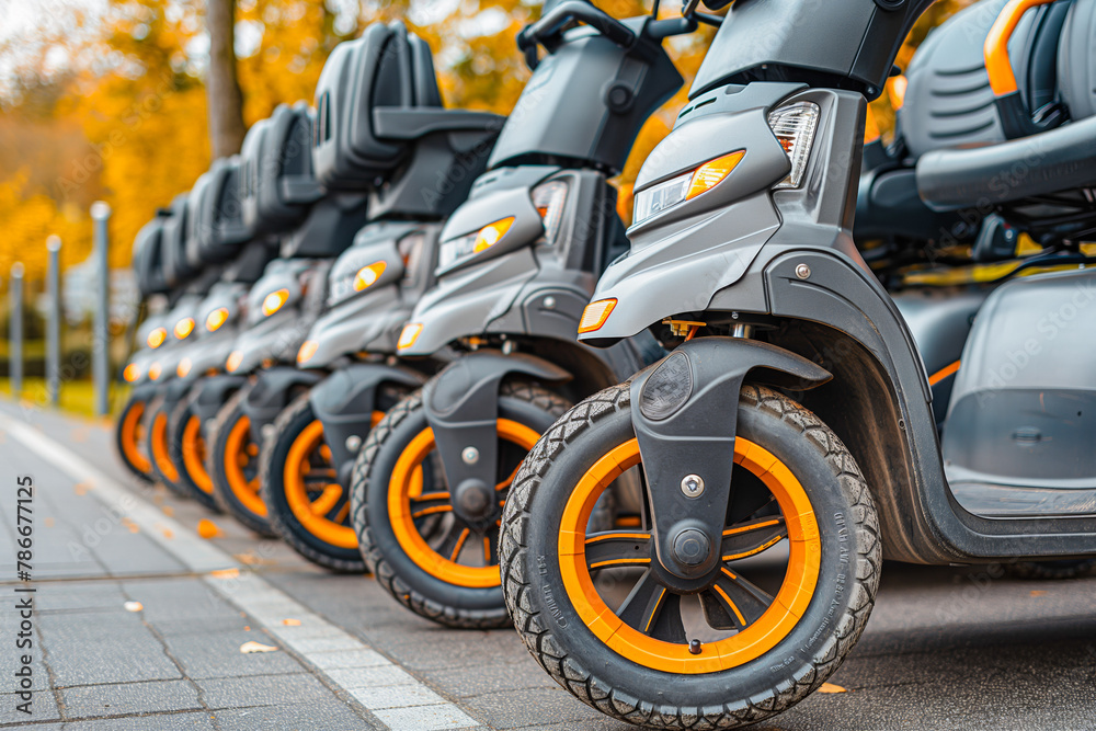Four wheel mobility electric scooters charging up. Personal transport ...
