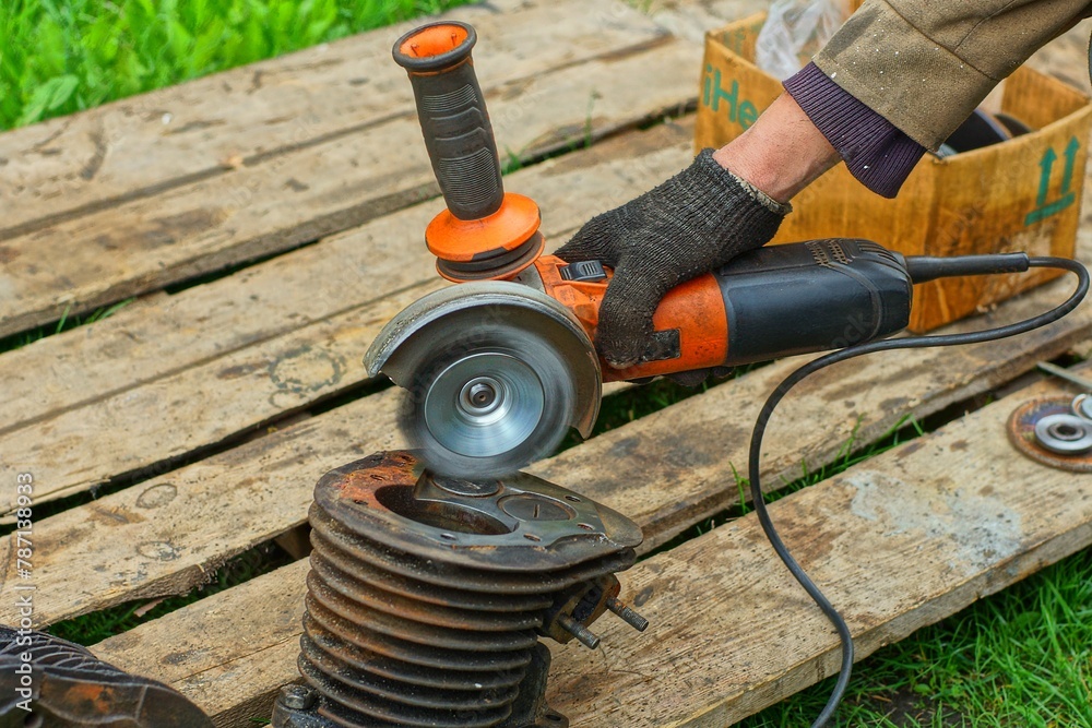 grinding orange electric dangerous powerful industrial machine in the ...