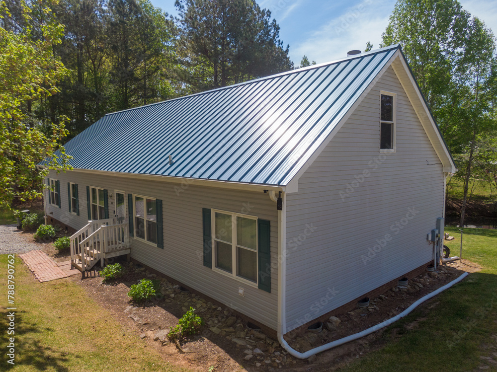 New steel metal light blue roof on a single family home featuring 5V ...
