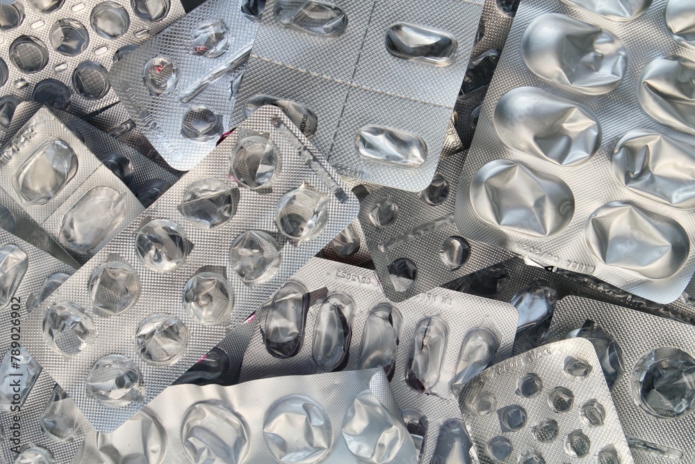 Pile of empty pill blister packs. Treatment and medication concept ...