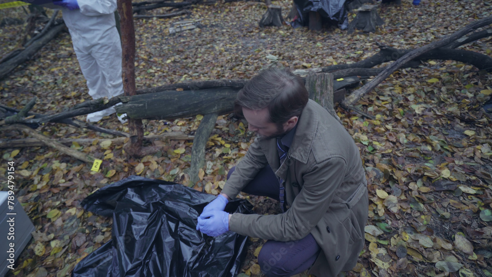 Detective reaches the crime scene where a murder victim lies in a body ...