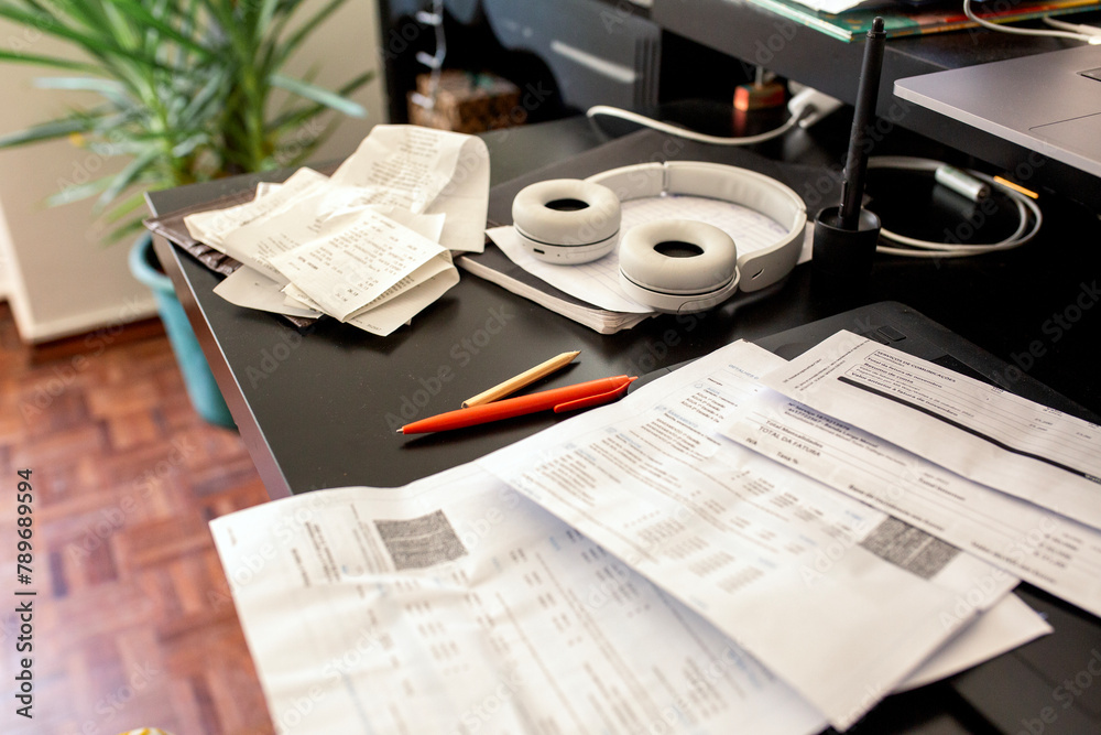 Messy workplace with receipts Stock Photo | Adobe Stock