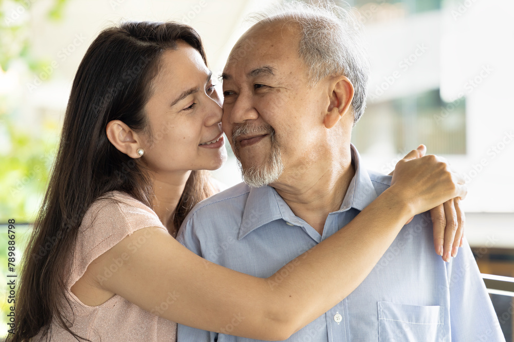 Senior Father and Middle aged Daughter smiling together in positive ...