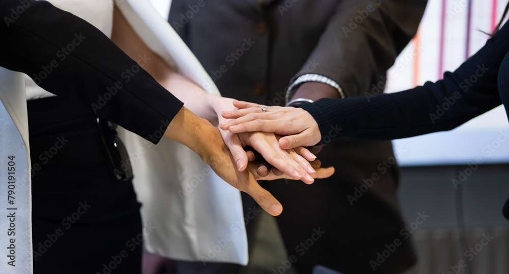Unity and teamwork - Professional business team hands together ...