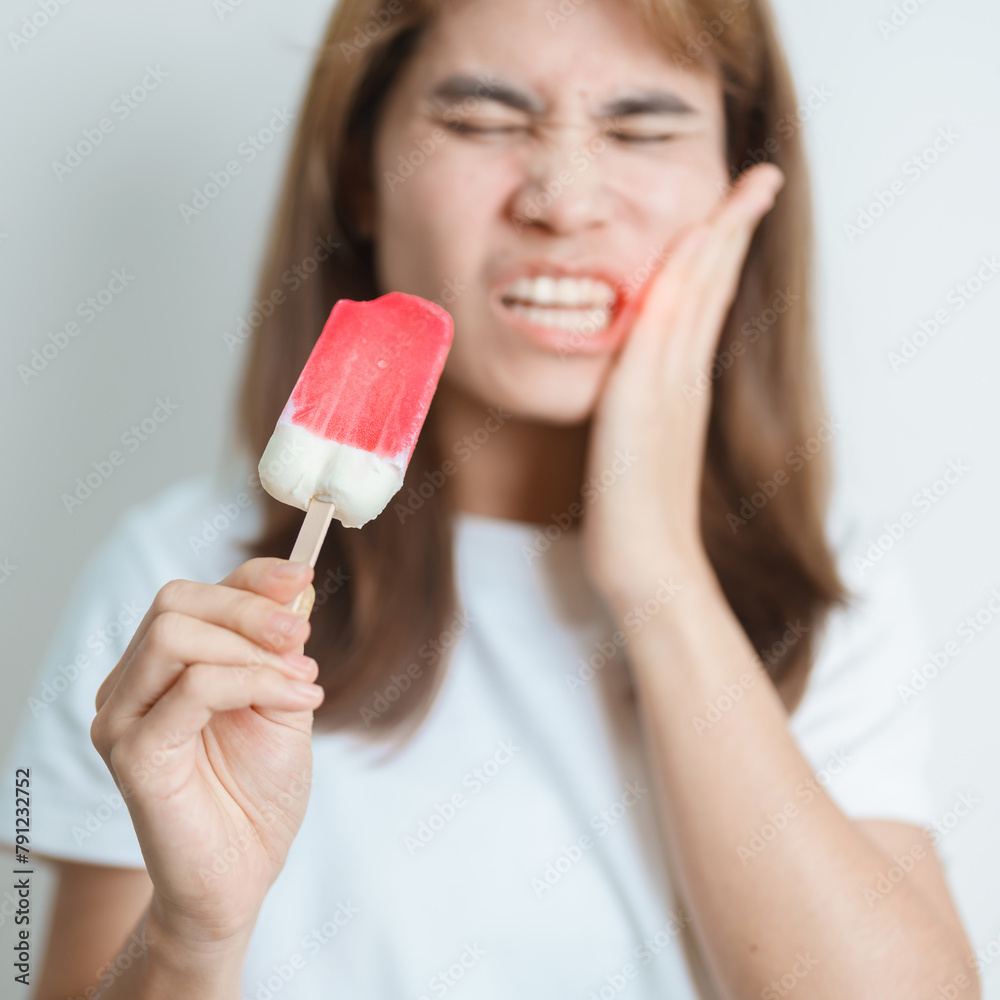 Teeth Sensitive to Cold concept. woman hold Ice cream and having ...