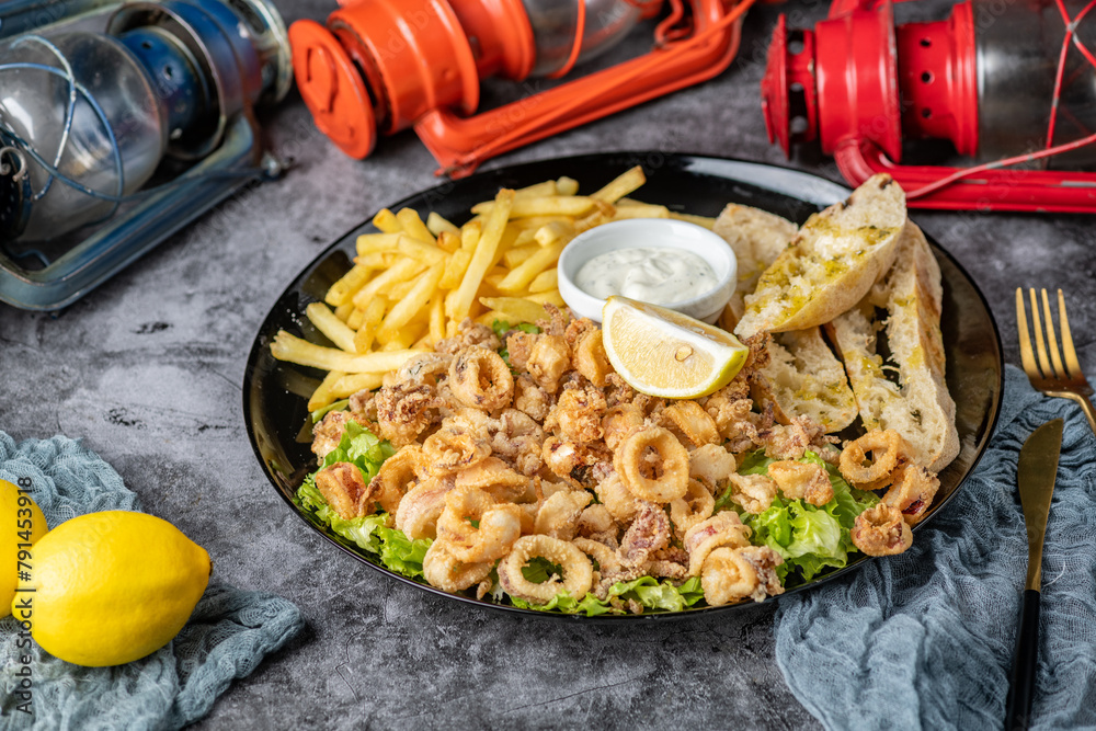 Fried squid, also known as calamari, are sliced into rings, lightly ...