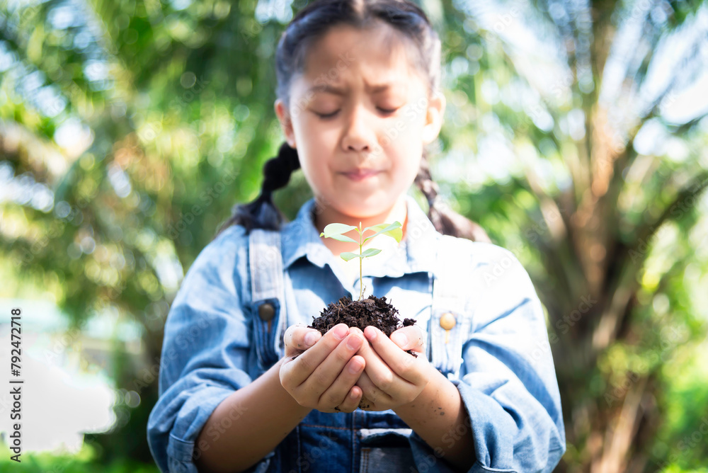 Ecology sapling tree growing up and planting on land. Hands kids Team ...