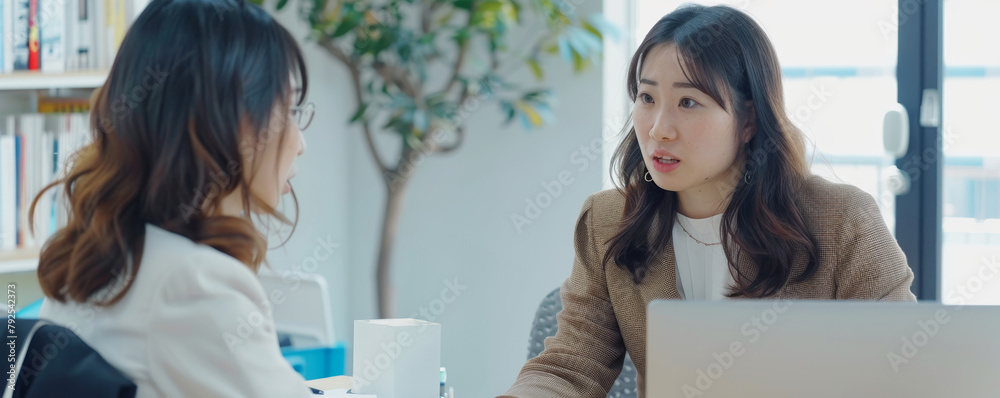 Japanese asian woman in her thirties is having an interview with ...