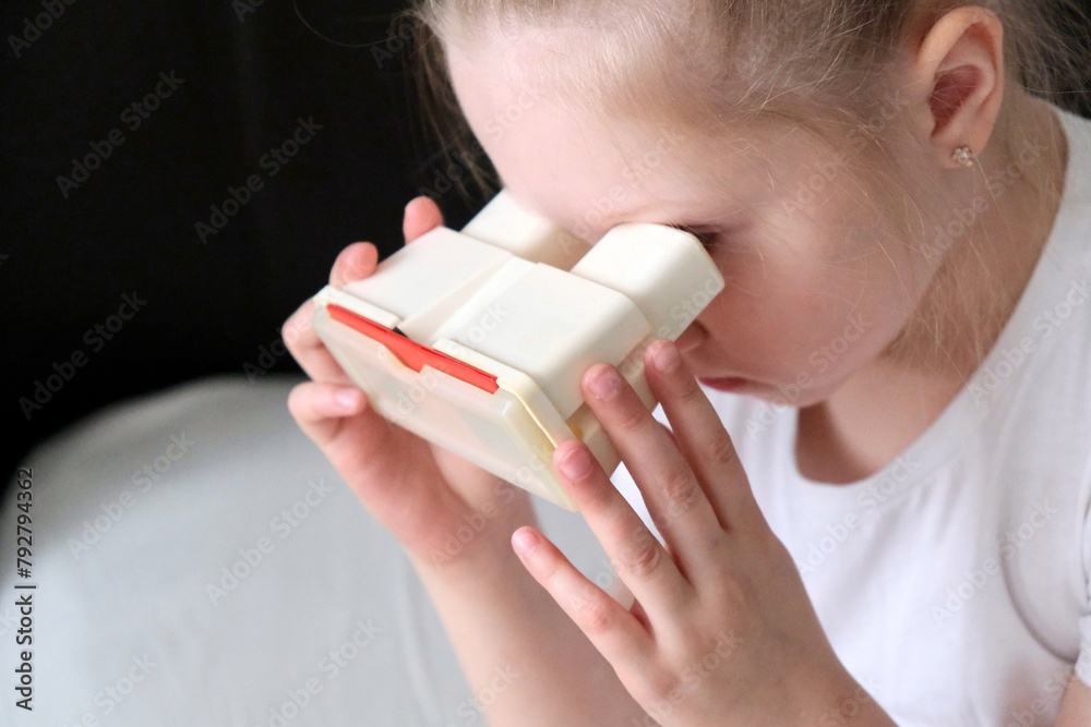 A child is watching slides through a slide show. Retro, slides. Old ...