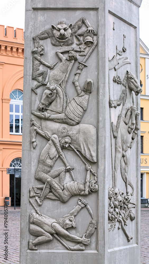 Schwerin, Germany. Satirical relief on the column of the Trace of the ...