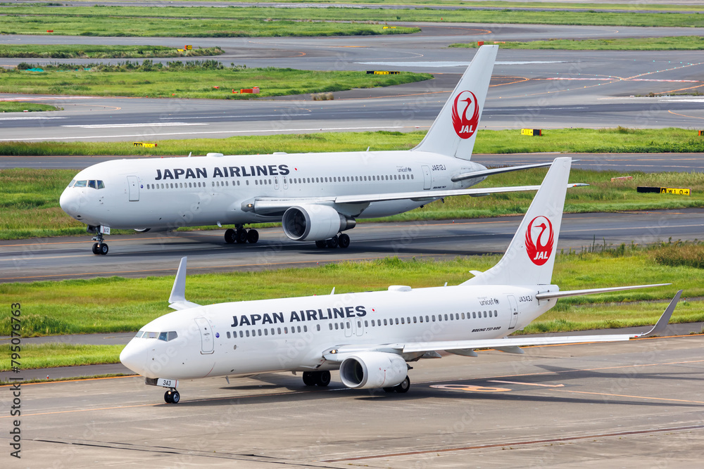 Japan Airlines JAL Boeing 737-800 and Boeing 767-300ER airplanes at Tokyo Haneda Airport in ...