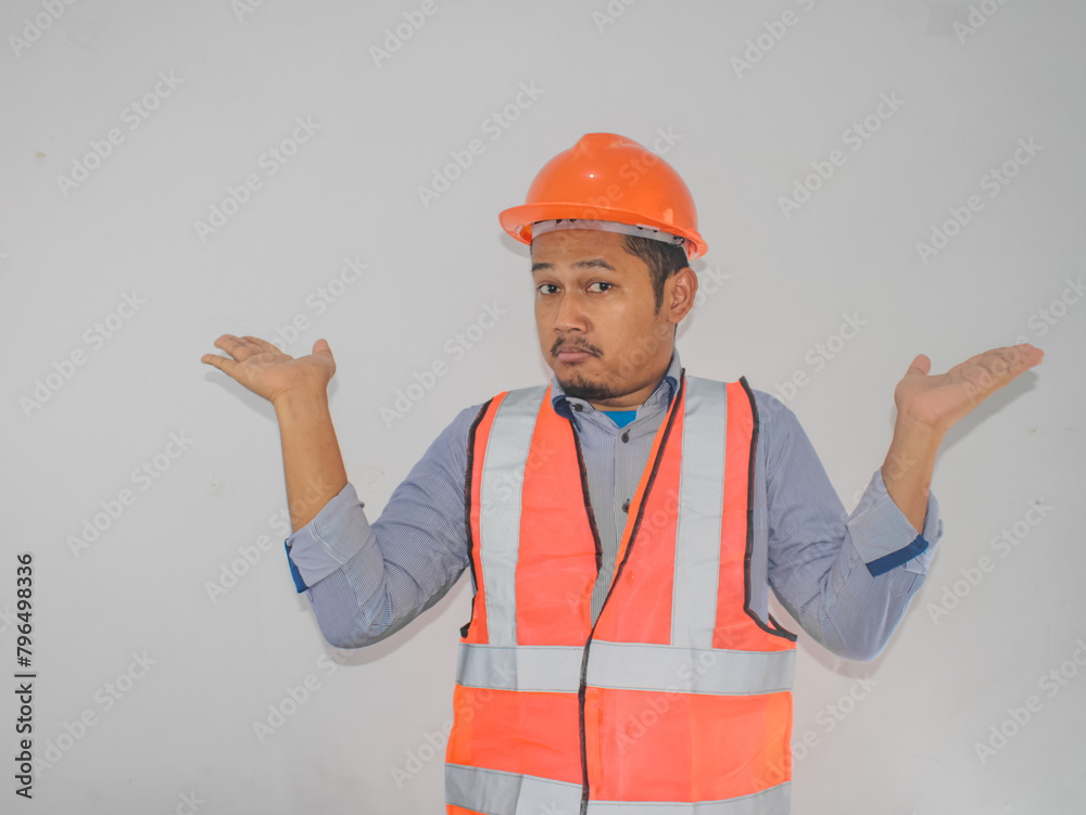 asian worker man wearing orange safety vest uniform and helmet clueless ...