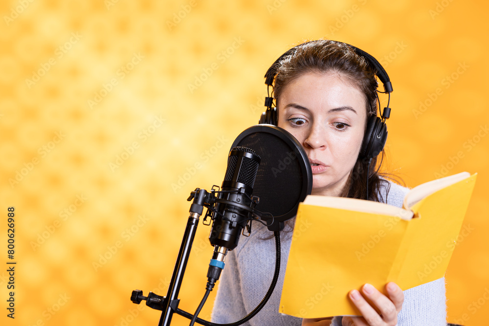 Narrator with shocked look on face reading horror book, recording ...