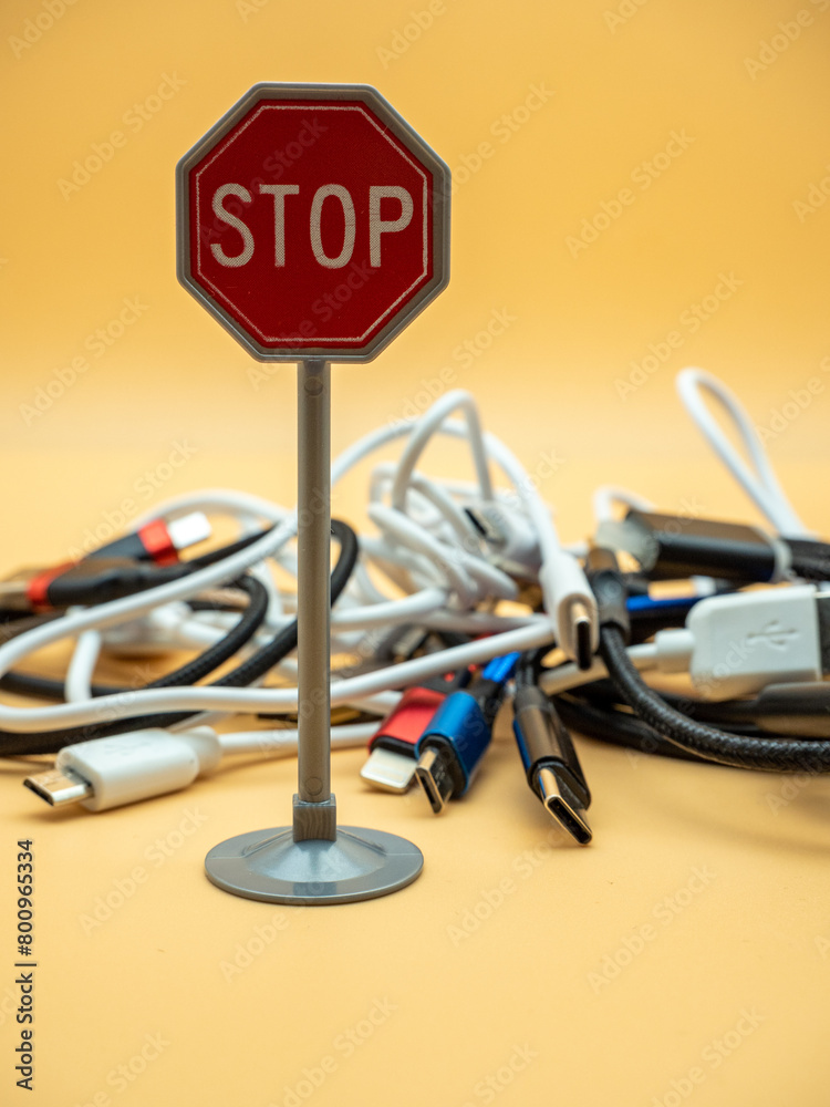 pile of tangled old smart technology wires, used charging cables and ...