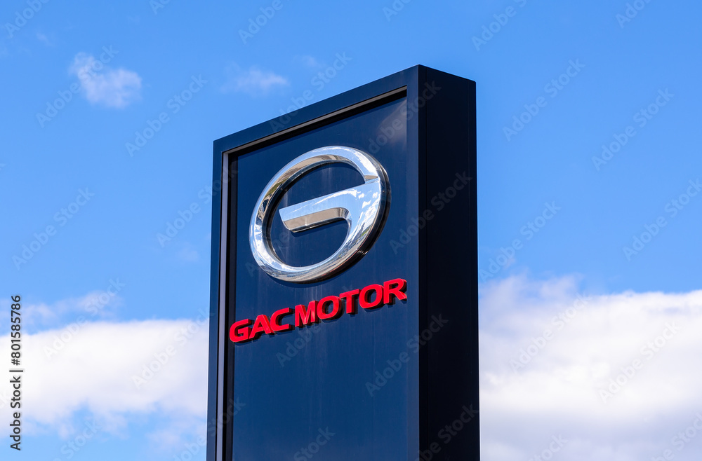 Stela with Gac Motor logo against a sky background. Gac Motor is a ...