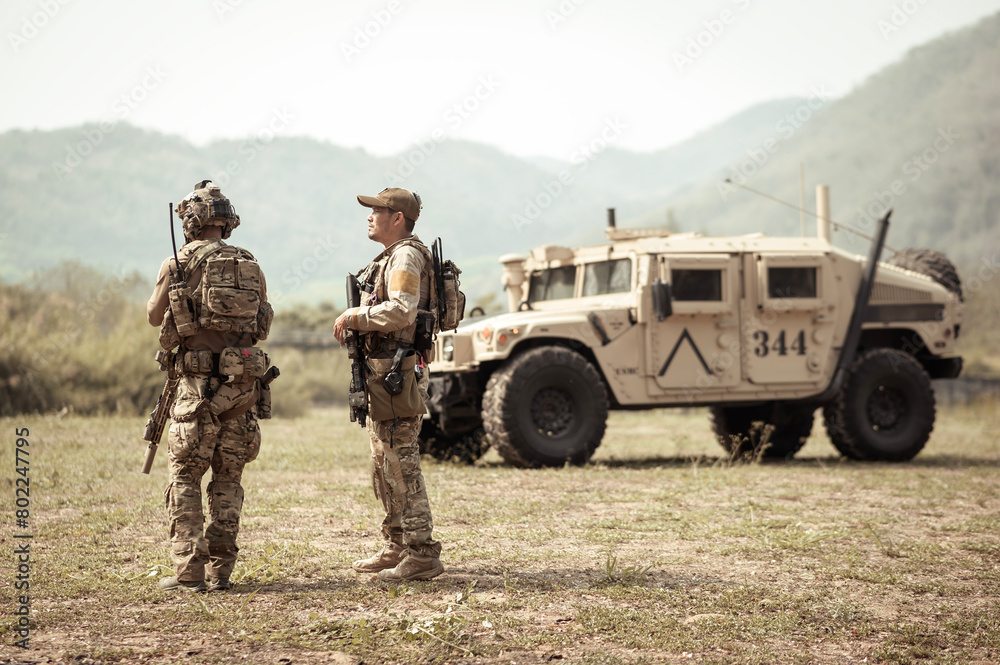 United States Army in camouflage uniforms operation in the forest.with ...