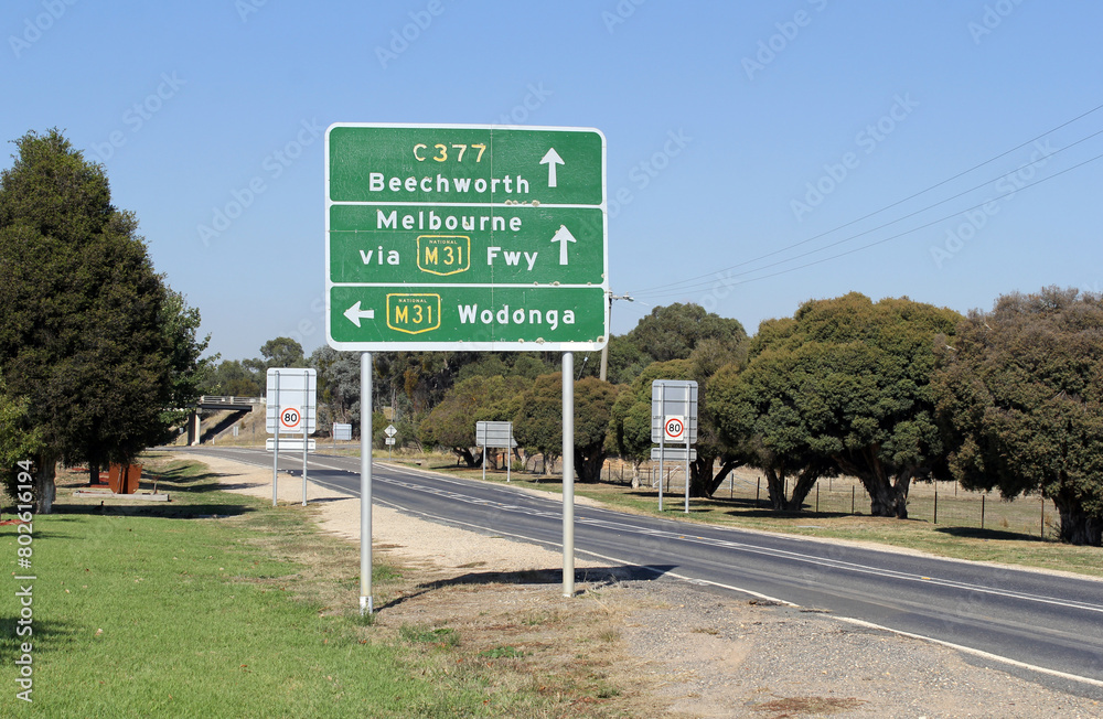 Road sign beside a road with trees in Chiltern pointing towards ...