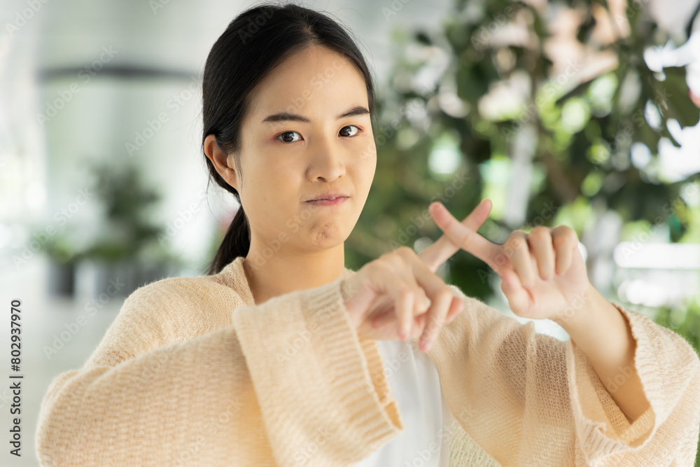 Angry Asian Woman Expressing Disagreement with X crossing finger Gesture, concept image of Wrong ...