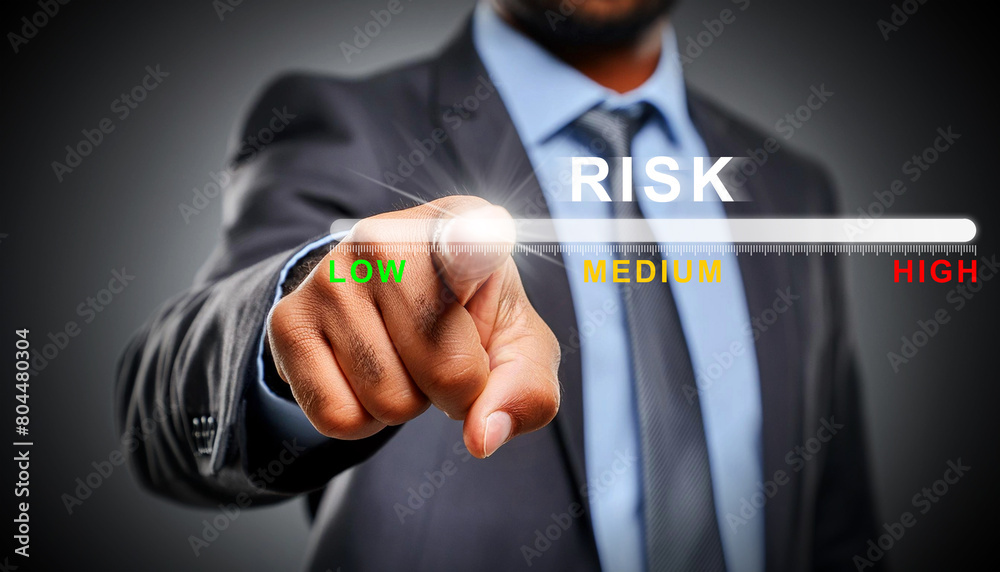 Close-up of a businessman hand touching or pointing the risk management ...