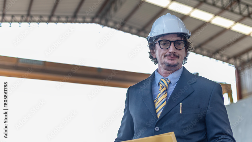 Civil engineer or manager with suit and safety hat stands confident in ...