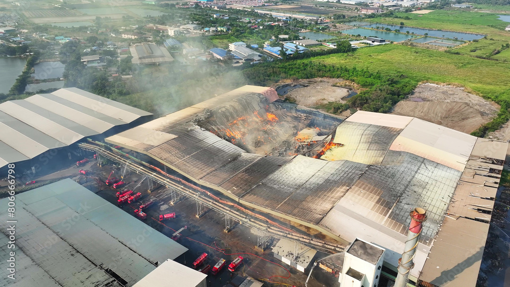 Amidst billowing smoke and towering flames, a colossal firefighting ...