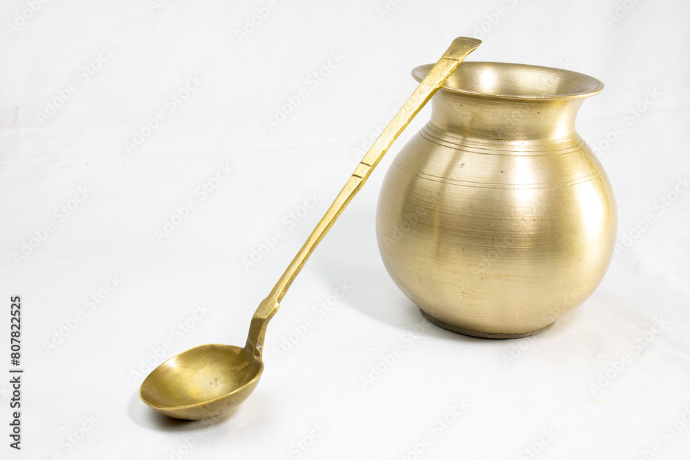 Empty golden brass vessels used as a water pot for traditional rituals ...