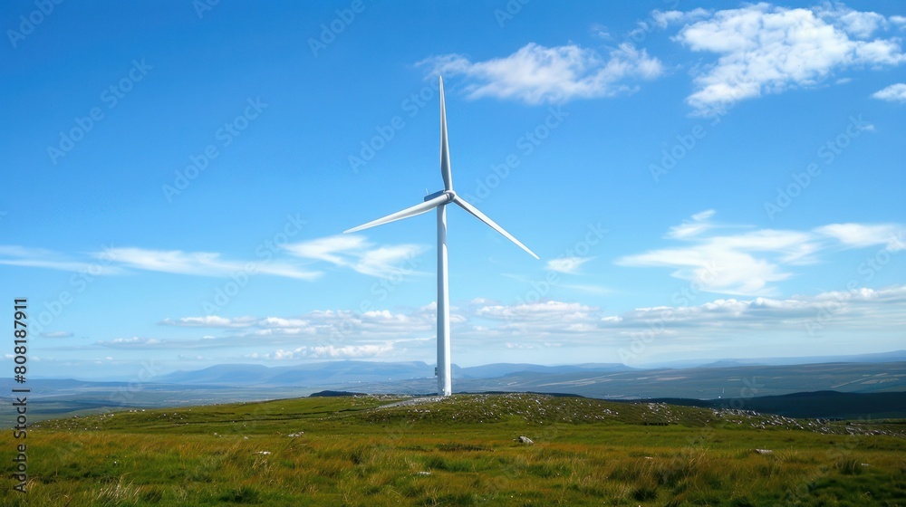 Single wind turbine on a vast highland with panoramic view under a ...