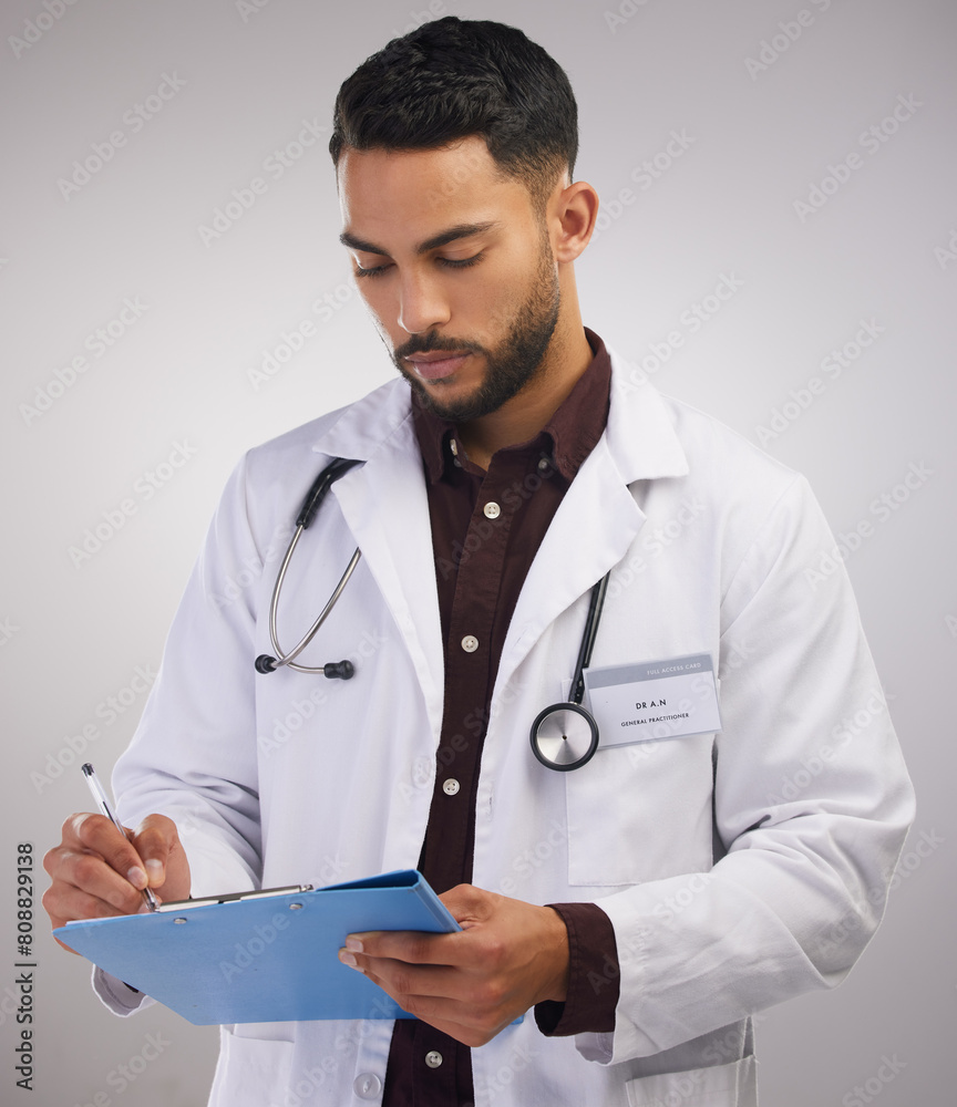 Doctor, chart and writing notes in studio for healthcare, wellness or ...